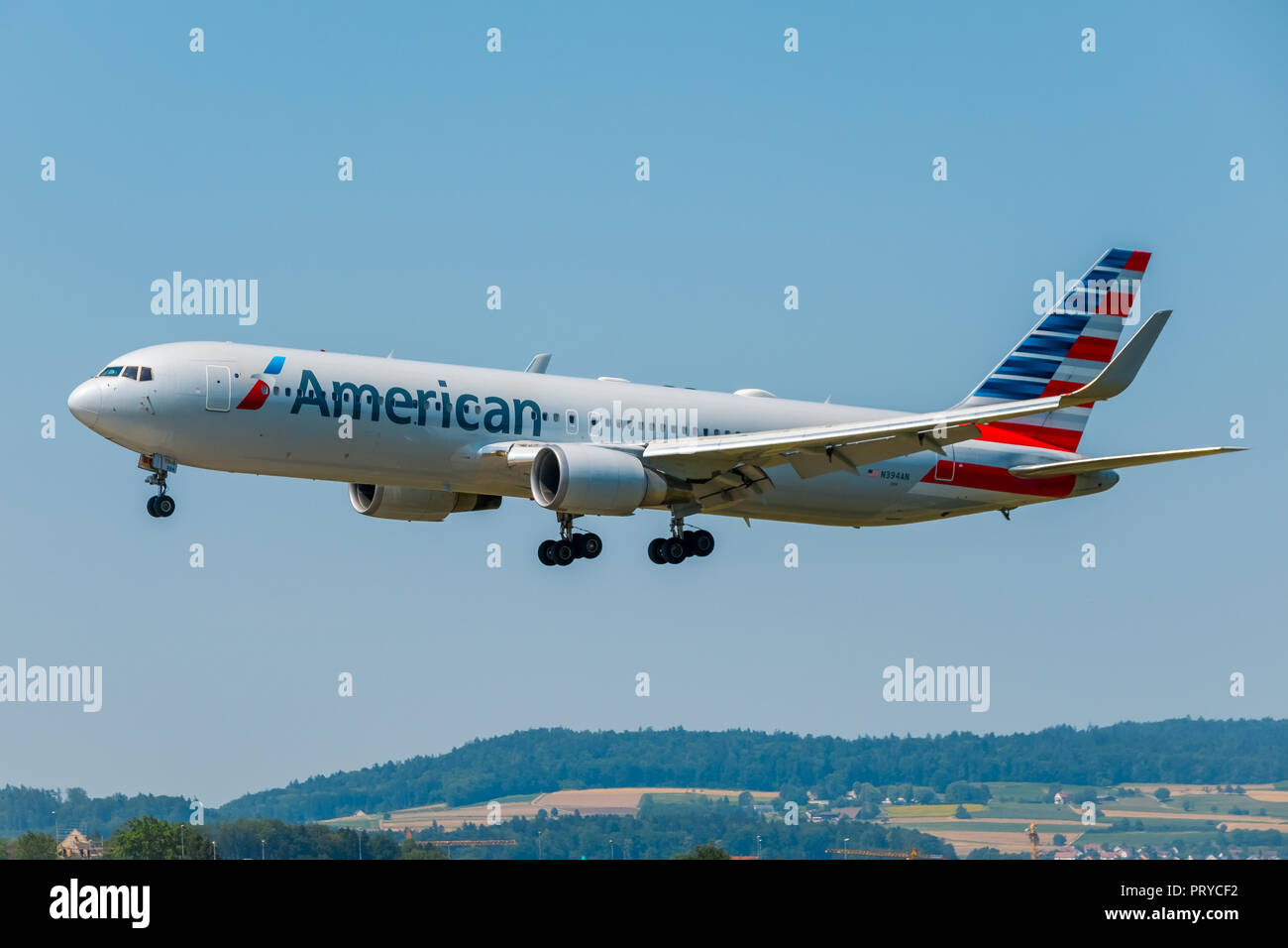 American airlines company airplane preparing for landing at day time in ...