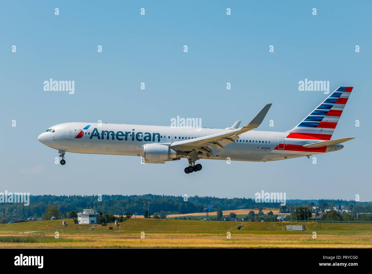 American airlines company airplane preparing for landing at day time in ...