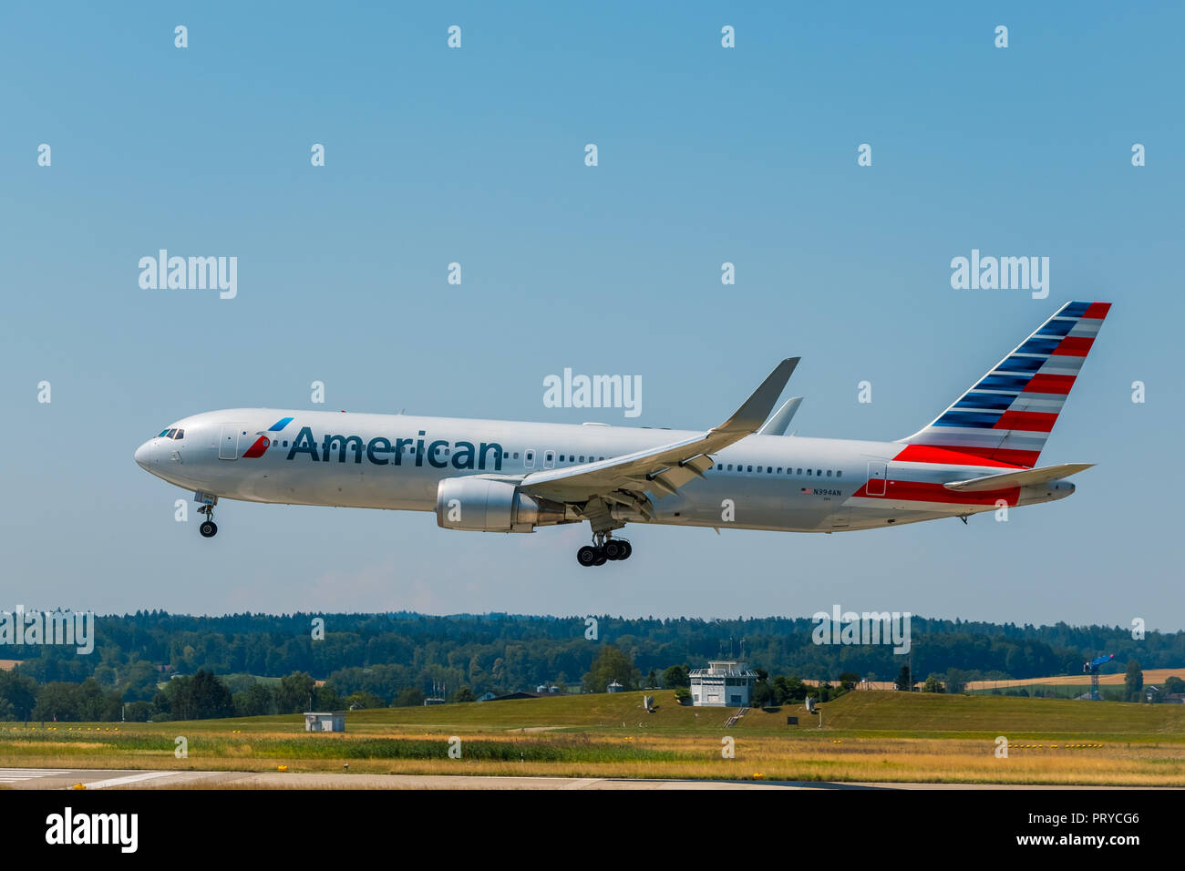 American airlines company airplane preparing for landing at day time in ...