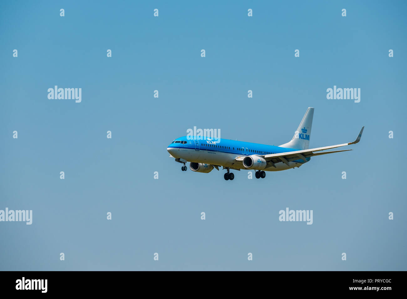 KLM dutch airlines company airplane preparing for landing at day time ...