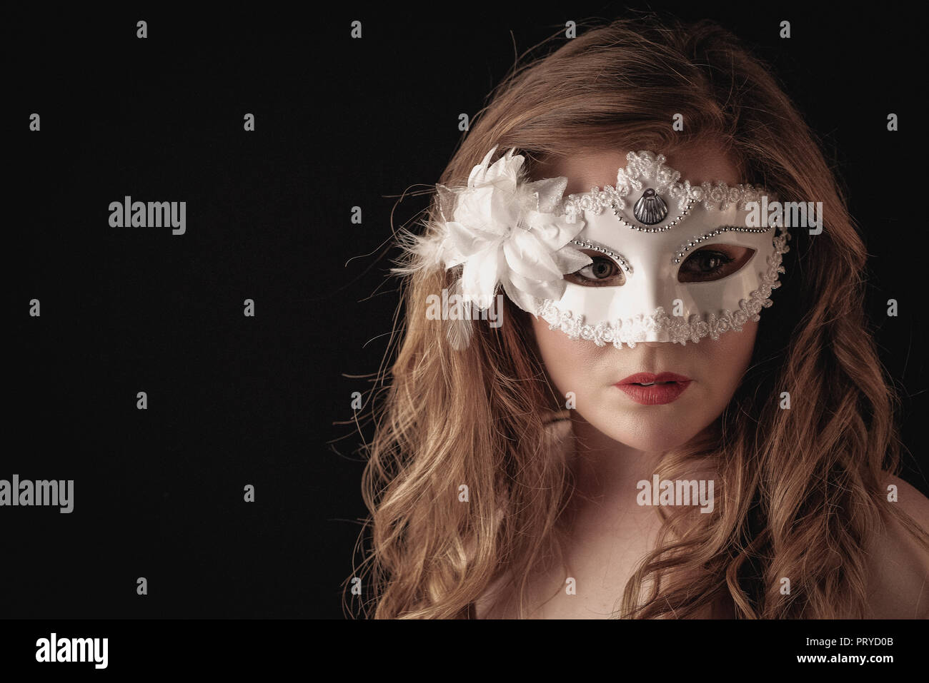 Redhead masked woman portrait Stock Photo - Alamy
