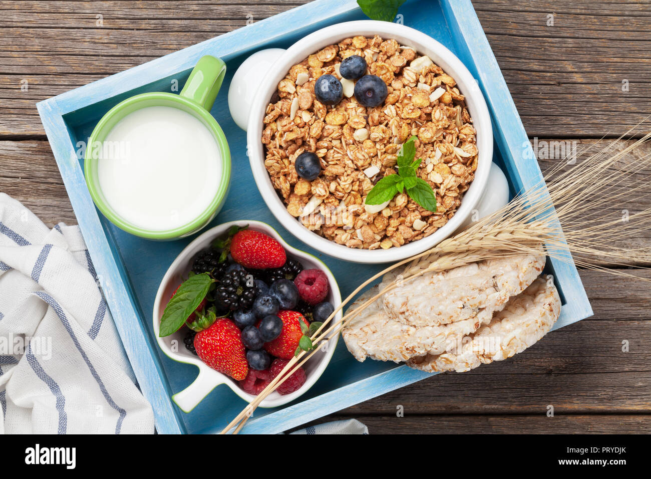 Healthy breakfast set with muesli, berries and milk. Top view Stock ...