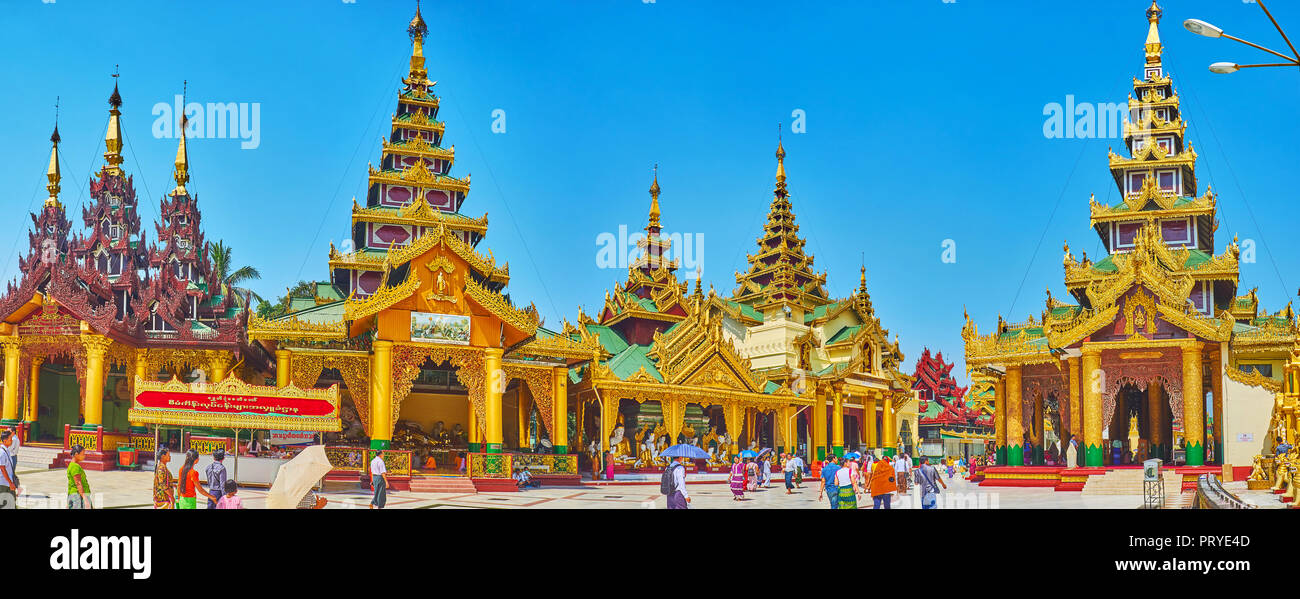 YANGON, MYANMAR - FEBRUARY 27, 2018: Panorama with pyatthat roofs of ...