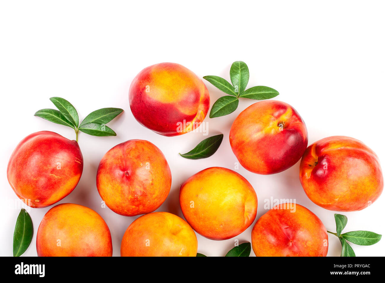 ripe nectarine with leaves isolated on white background with copy space ...