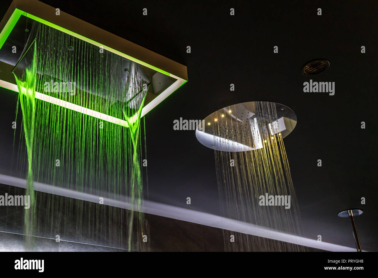 Chromotherapy and water falling from shower heads Stock Photo - Alamy