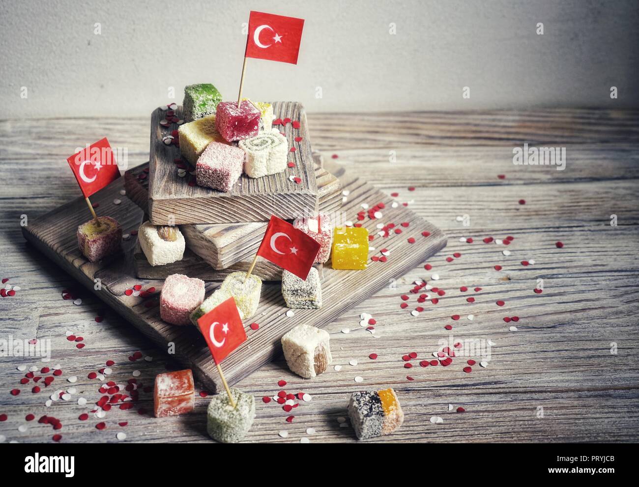 various national Oriental sweets, with paper flags of Turkey, Turkish ...