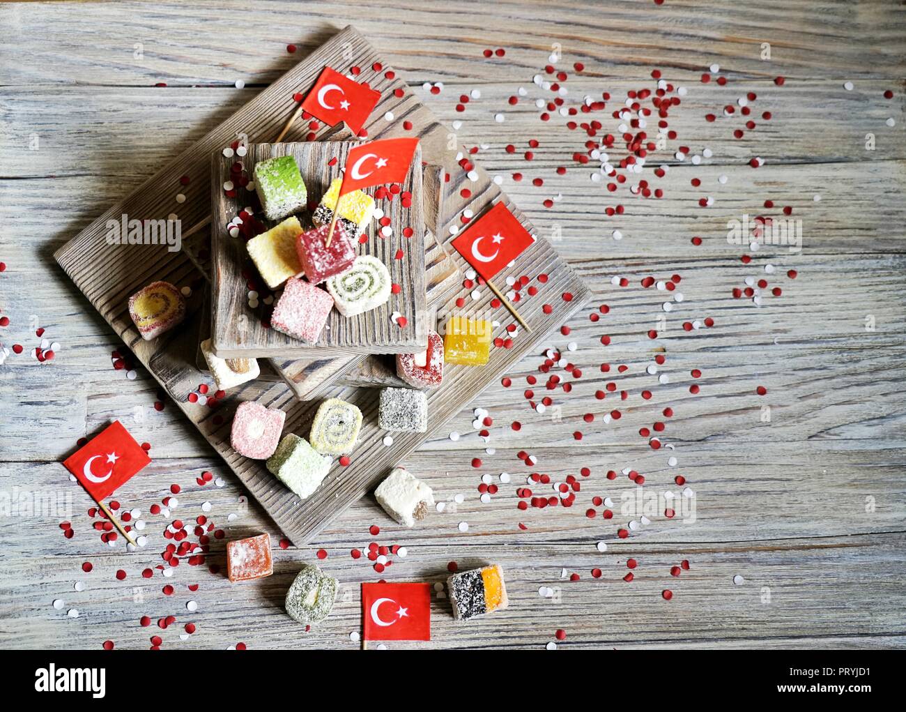 various national Oriental sweets, with paper flags of Turkey, Turkish ...