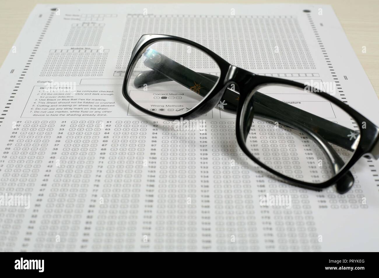 Picture of omr sheet and glasses. Isolated on white background Stock ...