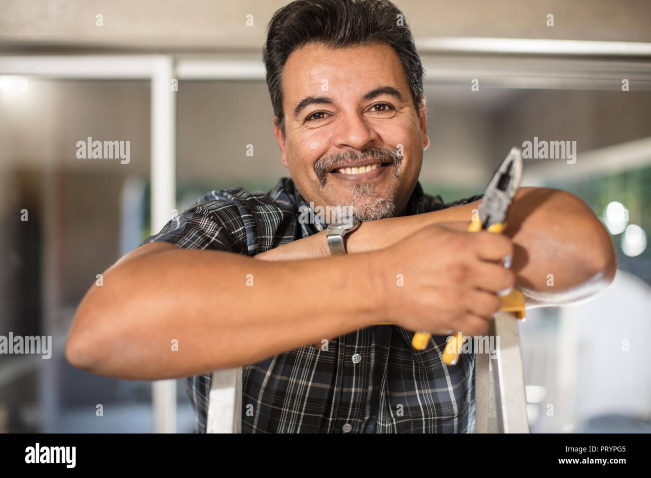 Man up ladders hi-res stock photography and images - Alamy
