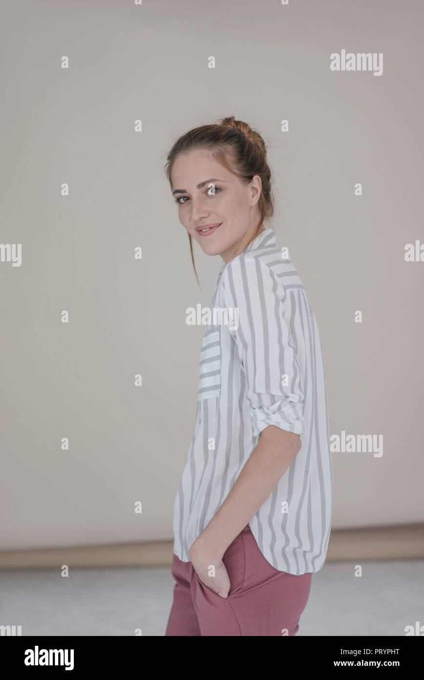 Woman looking over her shoulder hi-res stock photography and images - Alamy