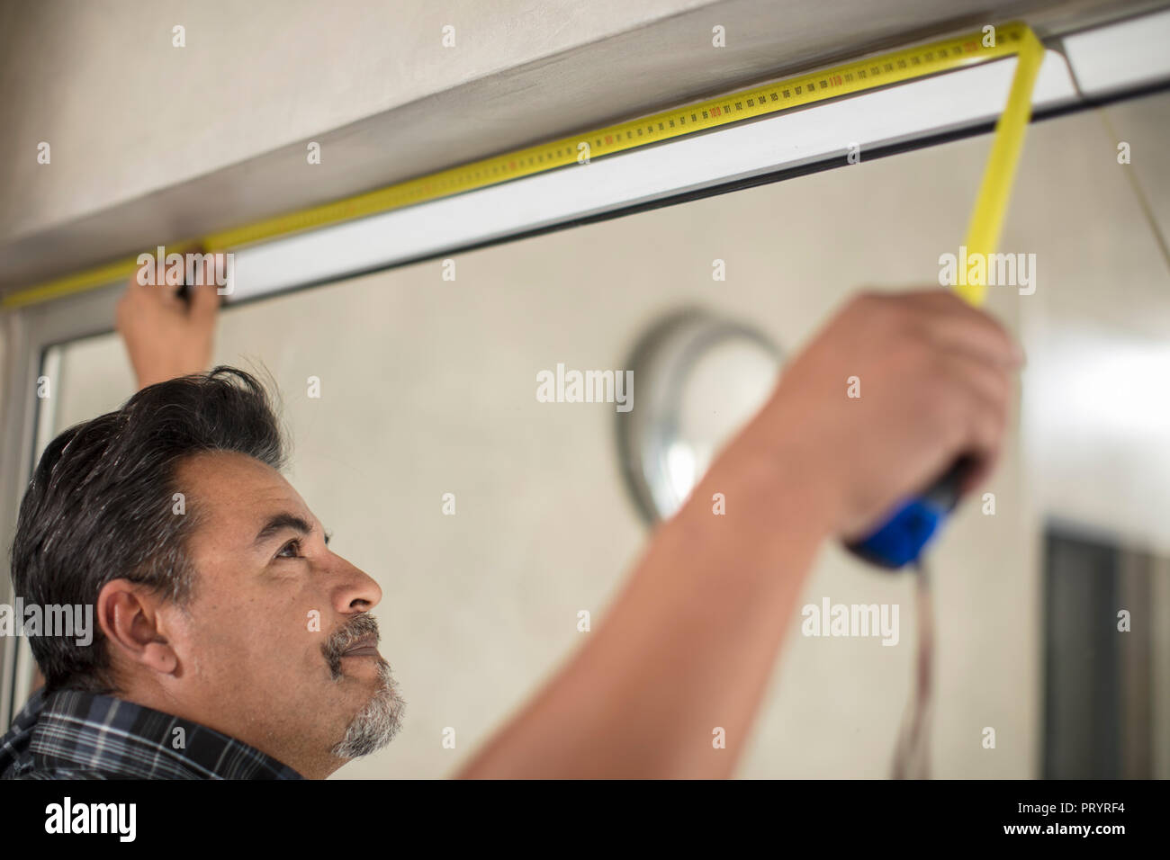 Man measuring window frame Stock Photo - Alamy Man measuring window frame Stock Photo - Alamy