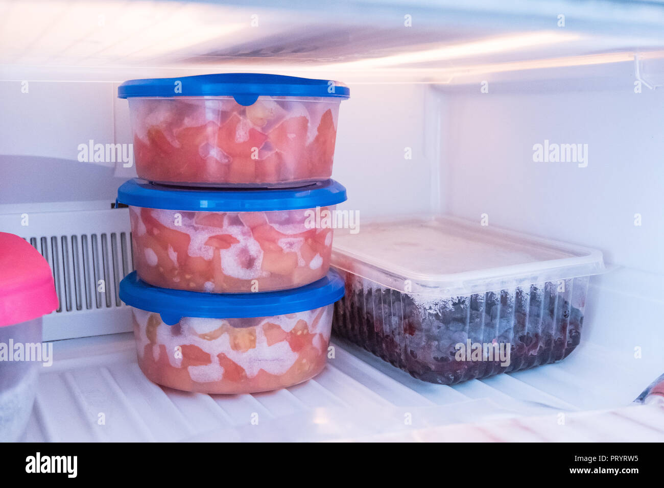 Frozen food in the freezer. Products for the winter in the refrigerator ...