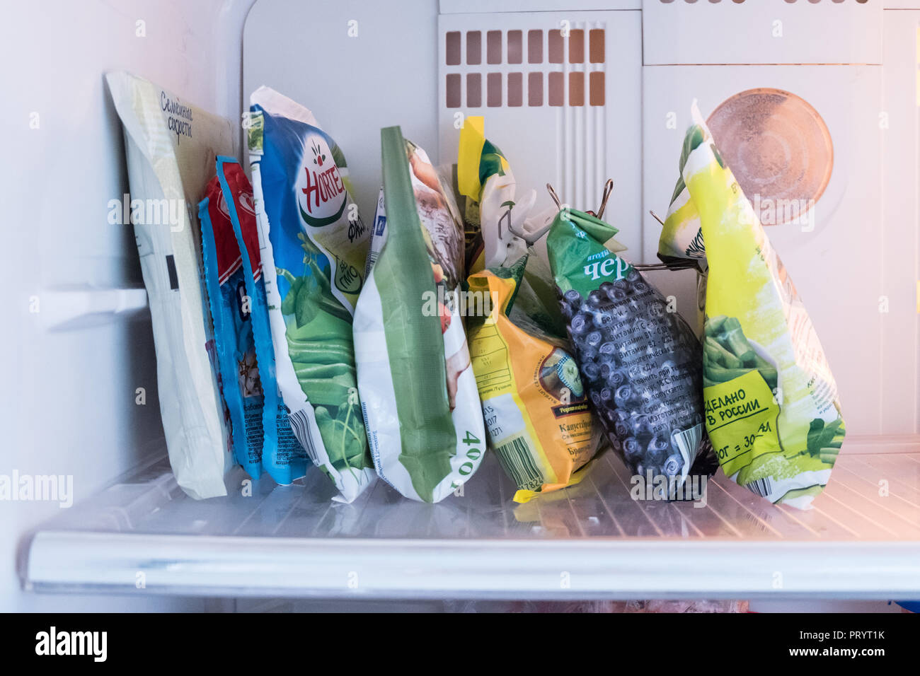 Frozen food in the freezer. Products for the winter in the refrigerator ...