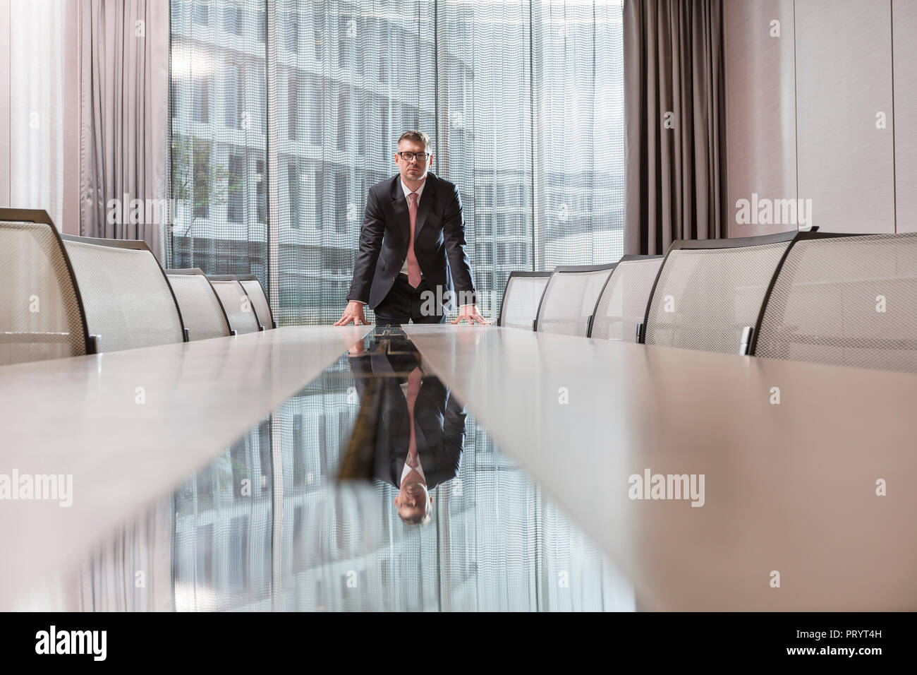 Businessman standing conference table hotel hi-res stock photography ...