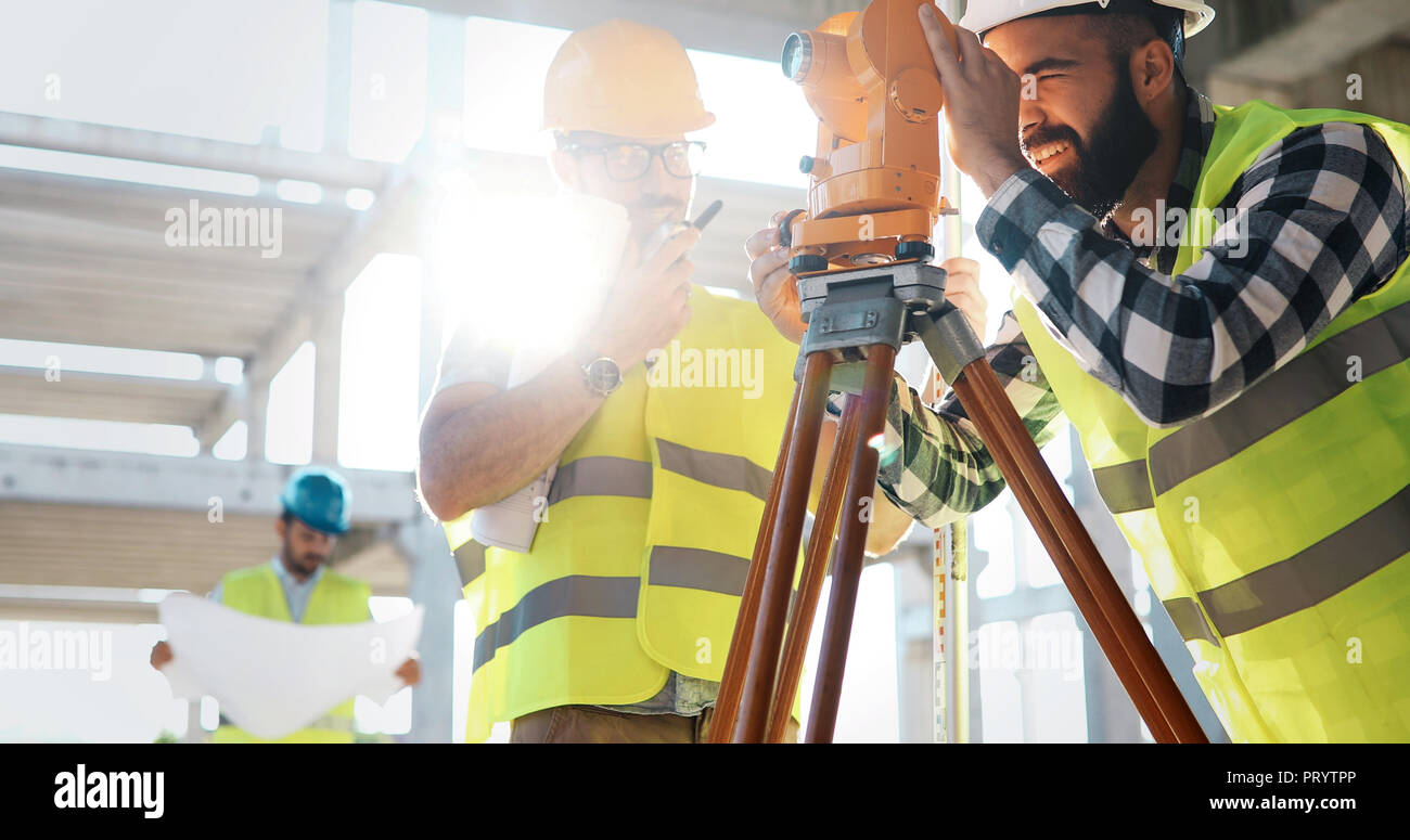 Portrait of construction engineers working on building site Stock Photo ...