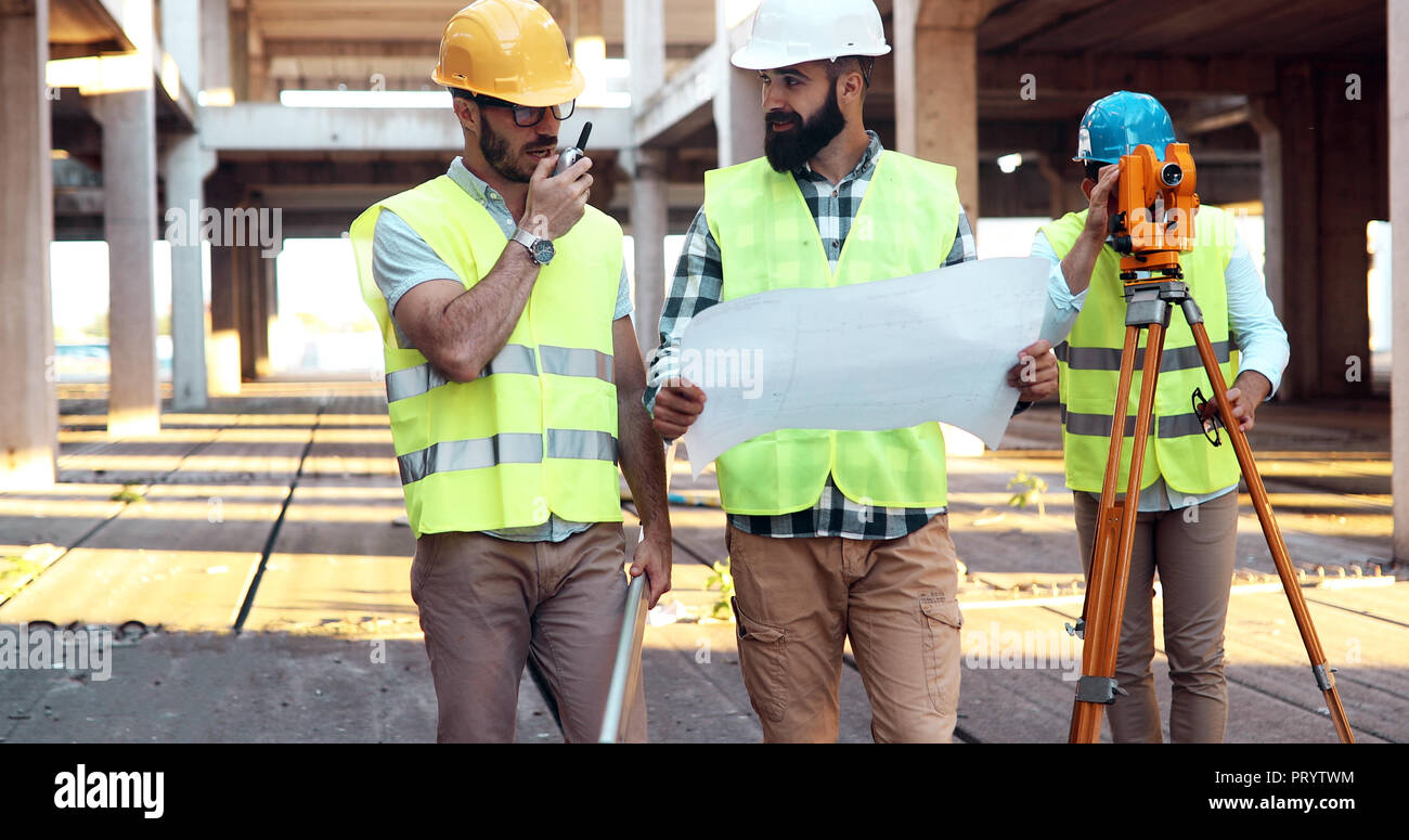 Team architects looking blueprints hi-res stock photography and images ...