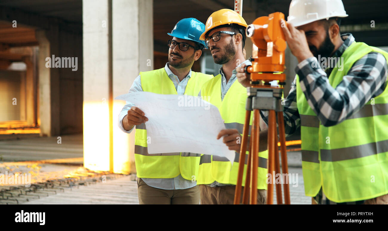 Portrait of construction engineers working on building site Stock Photo ...