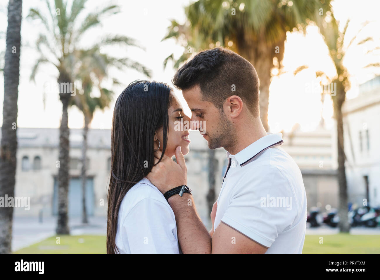 Young urban couple falling in love, kissing Stock Photo - Alamy