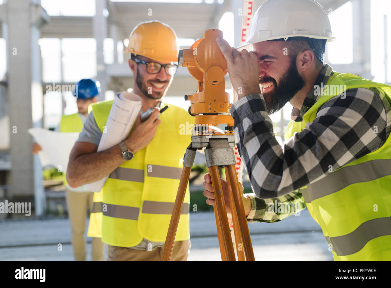 Portrait of construction engineers working on building site Stock Photo ...