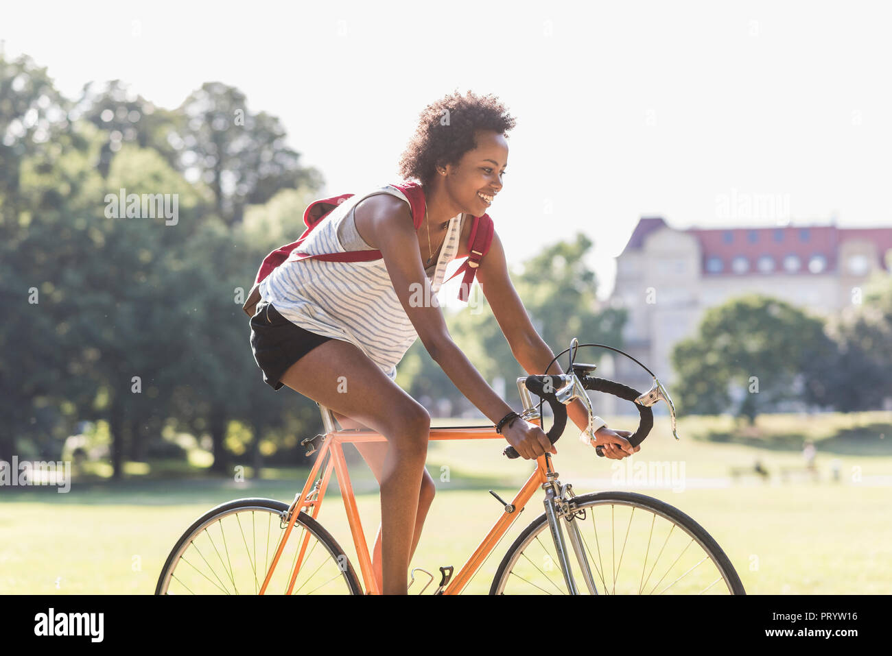 African woman riding bike hi-res stock photography and images - Alamy