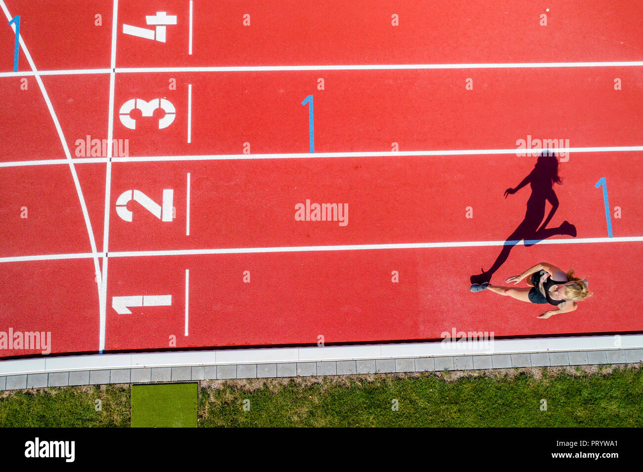 Athletic sports, female sprinter, finish from above Stock Photo - Alamy