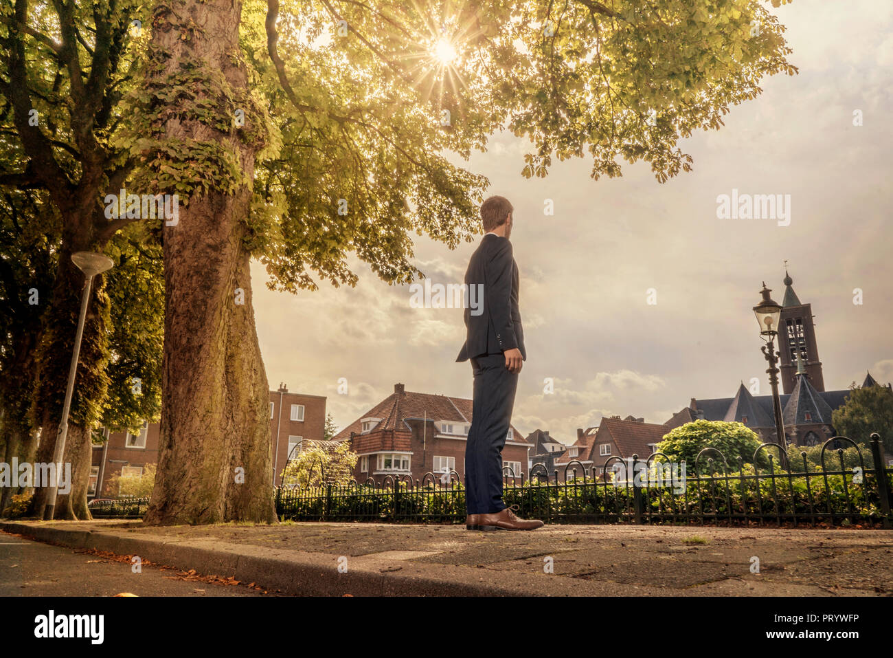 Businessman standing on pavement hi-res stock photography and images ...