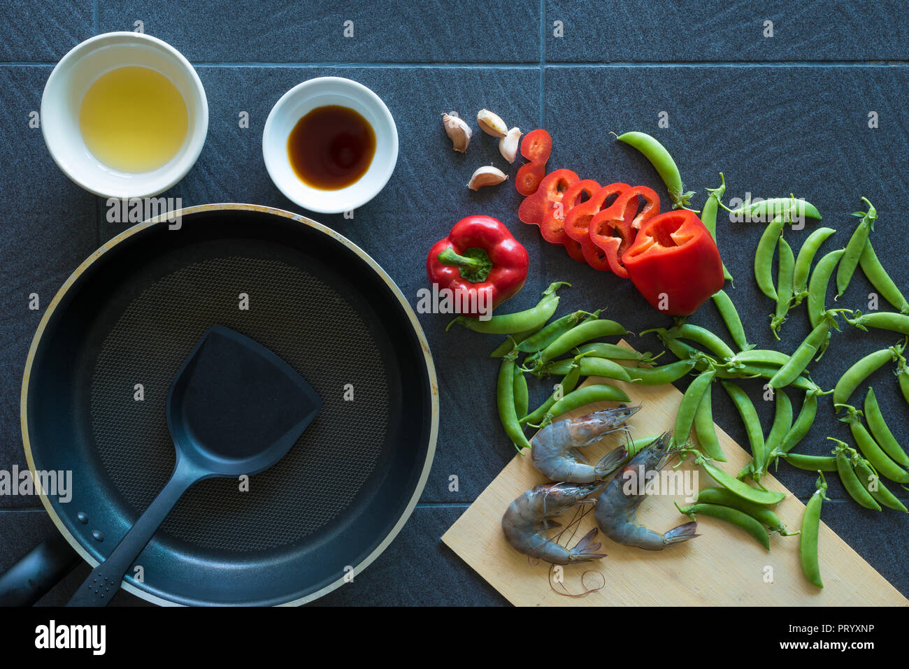 Flat lay of food ingredients and a pan ready to cook Stock Photo - Alamy