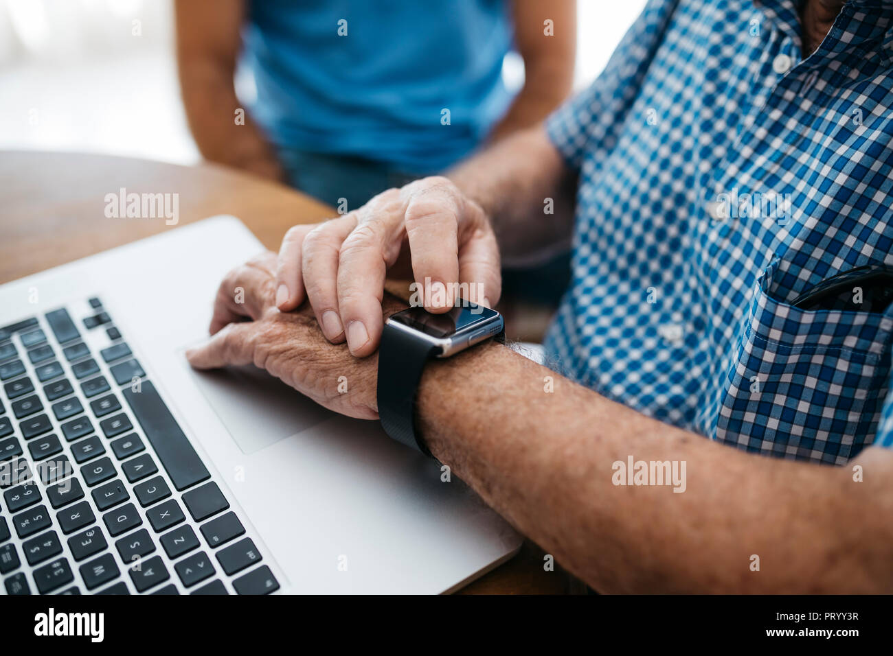 Senior man using smartwatch, close-up Stock Photo - Alamy