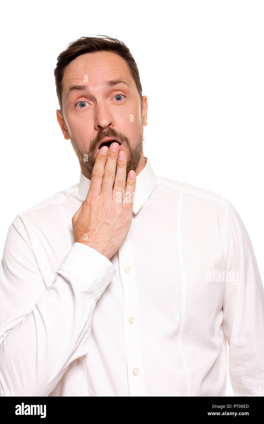 Vertical shot of stupefied stunned shocked young male keeps mouth ...