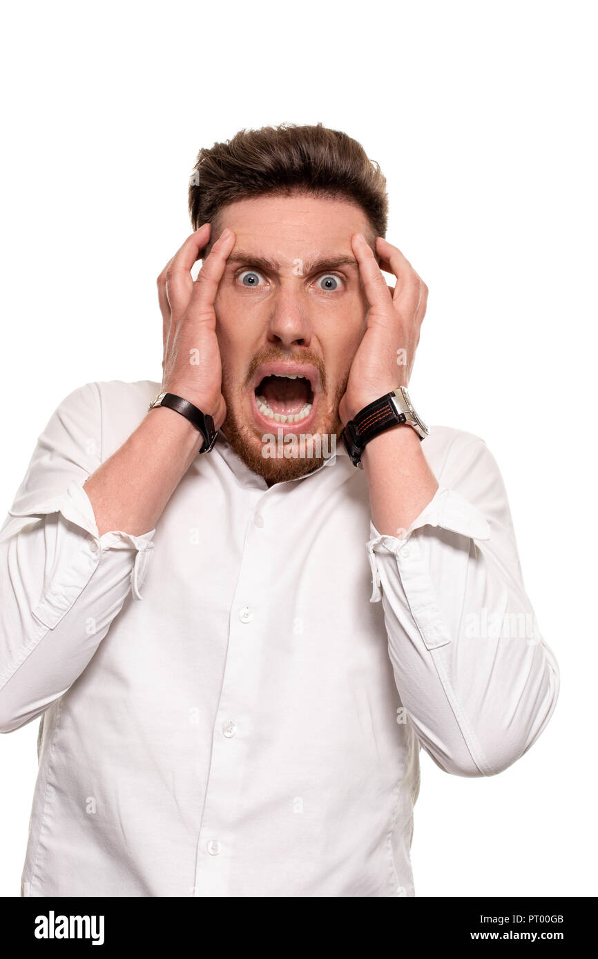 Vertical shot of stupefied stunned shocked young male keeps mouth ...