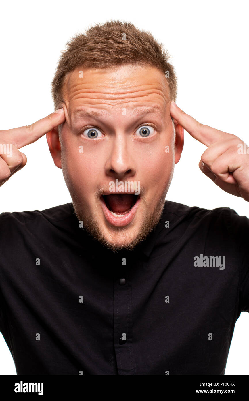Vertical shot of stupefied stunned shocked young male keeps mouth ...