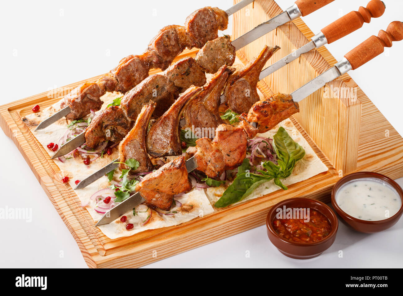 Khorovats- Traditional Armenian Kebab/skewers platter on wooden board ...