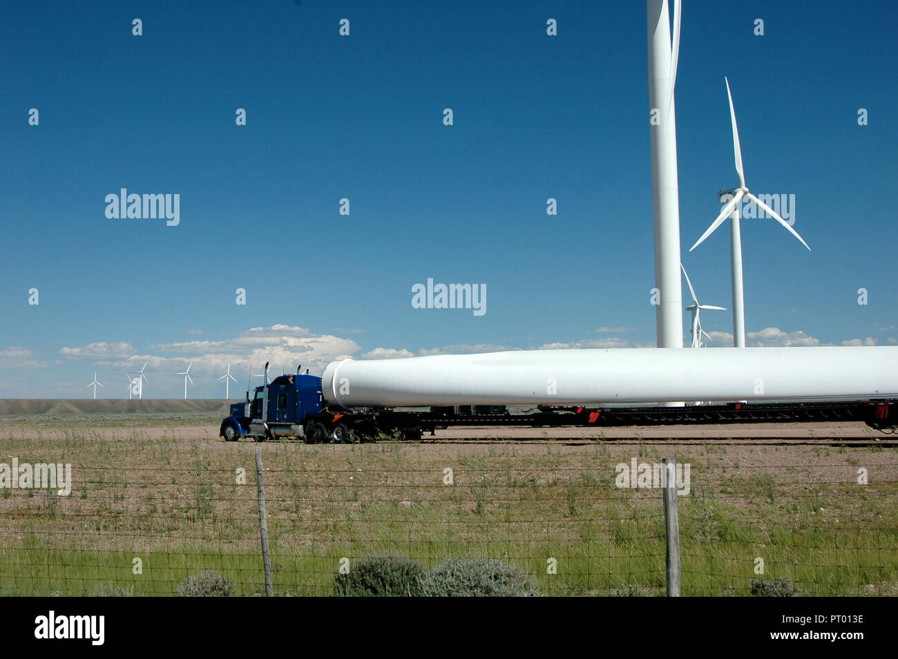 A wind turbine blade on a semi tractor trailer showing how large the ...