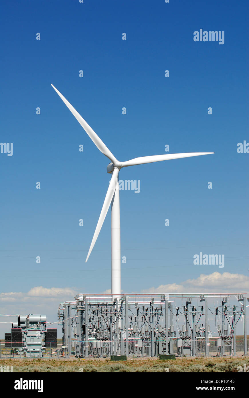 A wind turbine and a small power station Stock Photo - Alamy