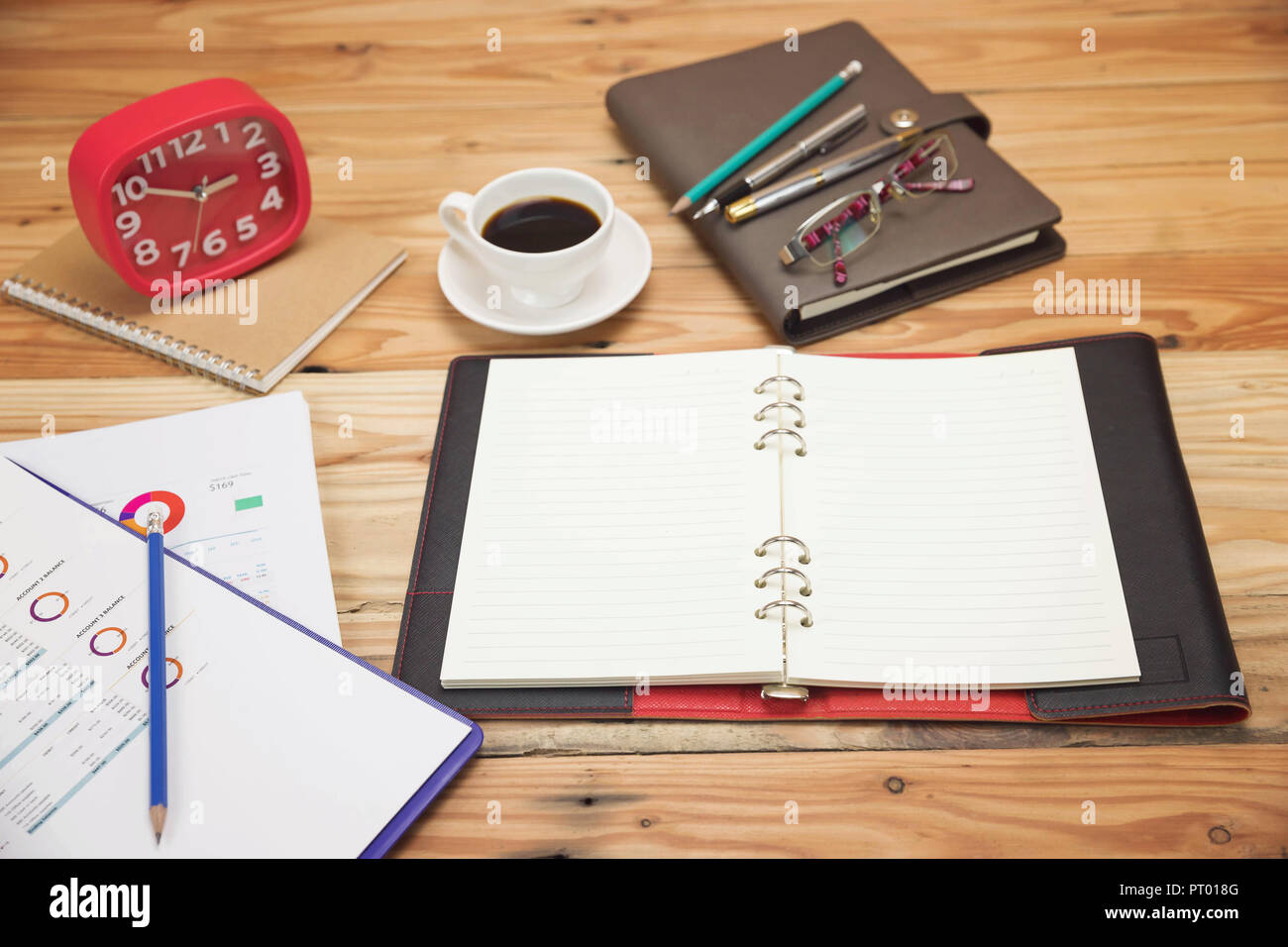 Top view of office desk with paper, stationery and analysis chart Stock ...