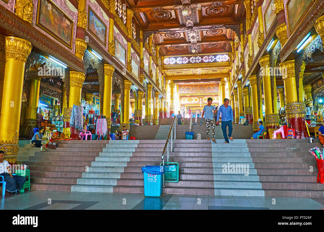 YANGON, MYANMAR - FEBRUARY 27, 2018: The Eastern Gate path of Shwedagon ...