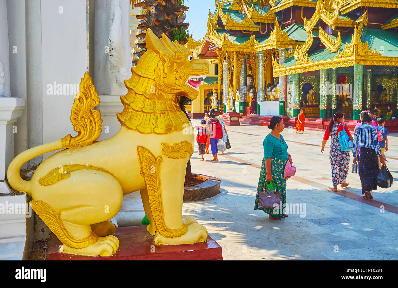 YANGON, MYANMAR - FEBRUARY 27, 2018: The golden statue of chinthe ...