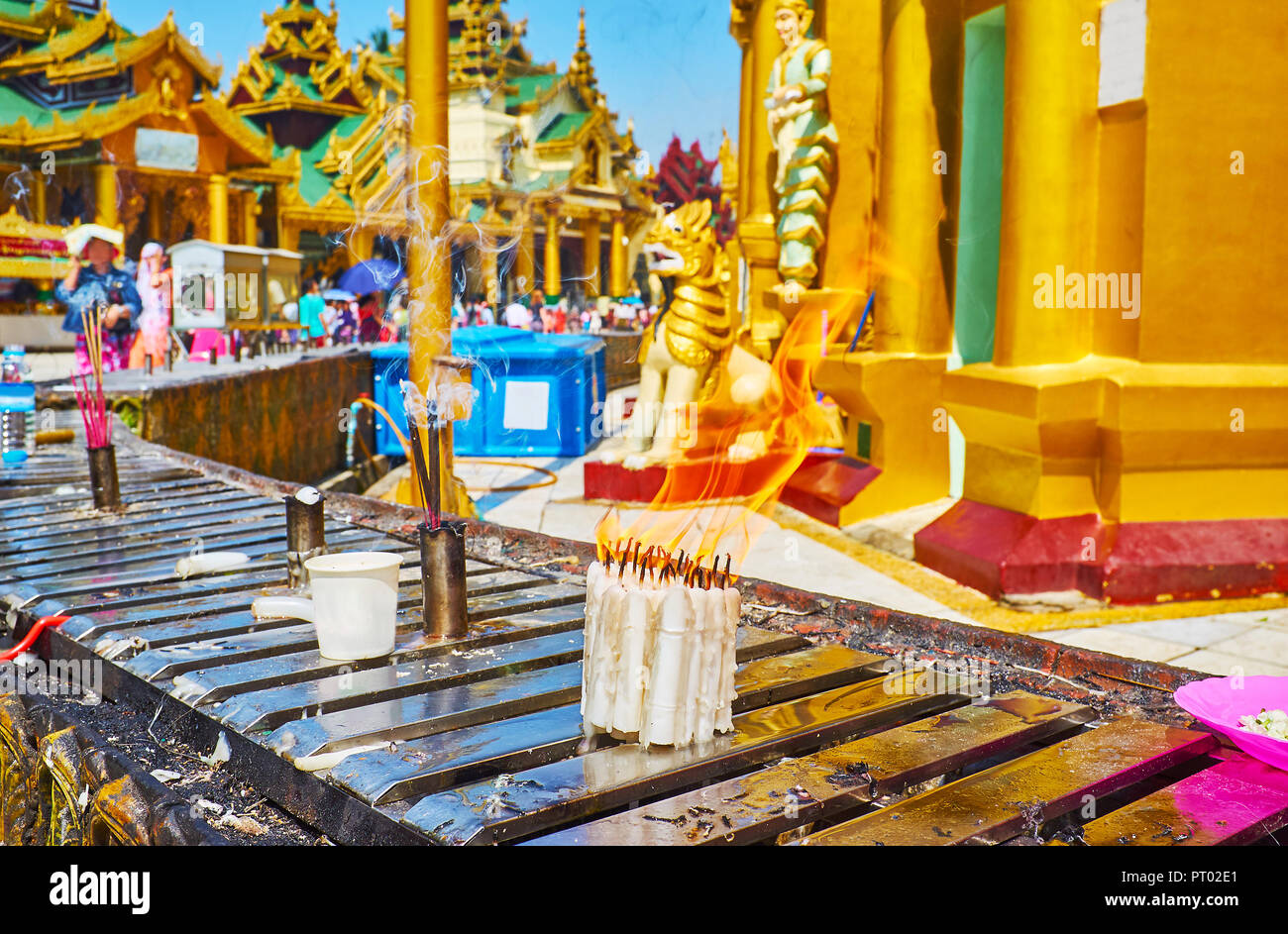 The burning incense sticks and candles on the altar at outer stupas of ...