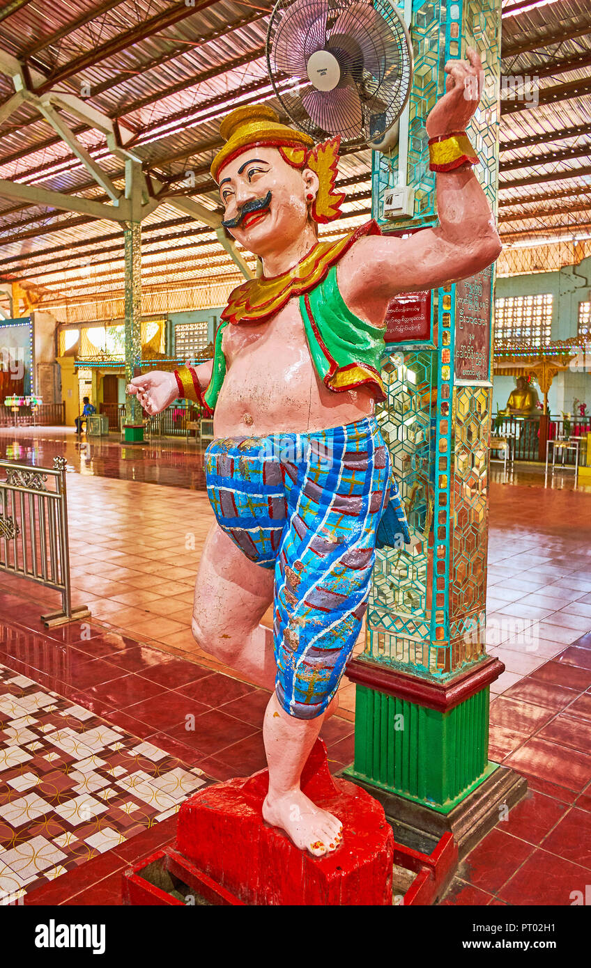 YANGON, MYANMAR - FEBRUARY 27, 2018: The sculpture of the laughing Nat (Spirit) in Ngar Htat Gyi ...