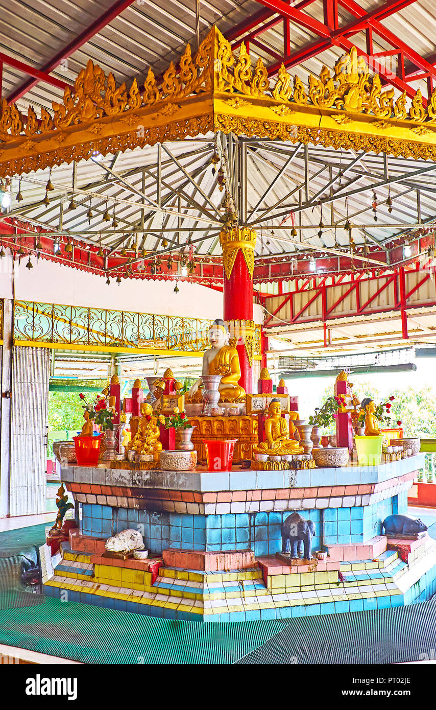 YANGON, MYANMAR - FEBRUARY 27, 2018: The circle altar, decorated with ...