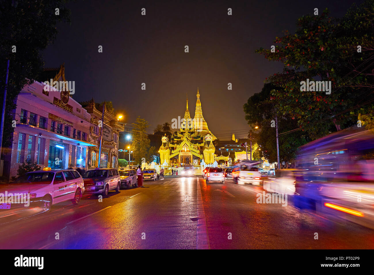 YANGON, MYANMAR - FEBRUARY 27, 2018: The evening traffic on Shwedagon ...