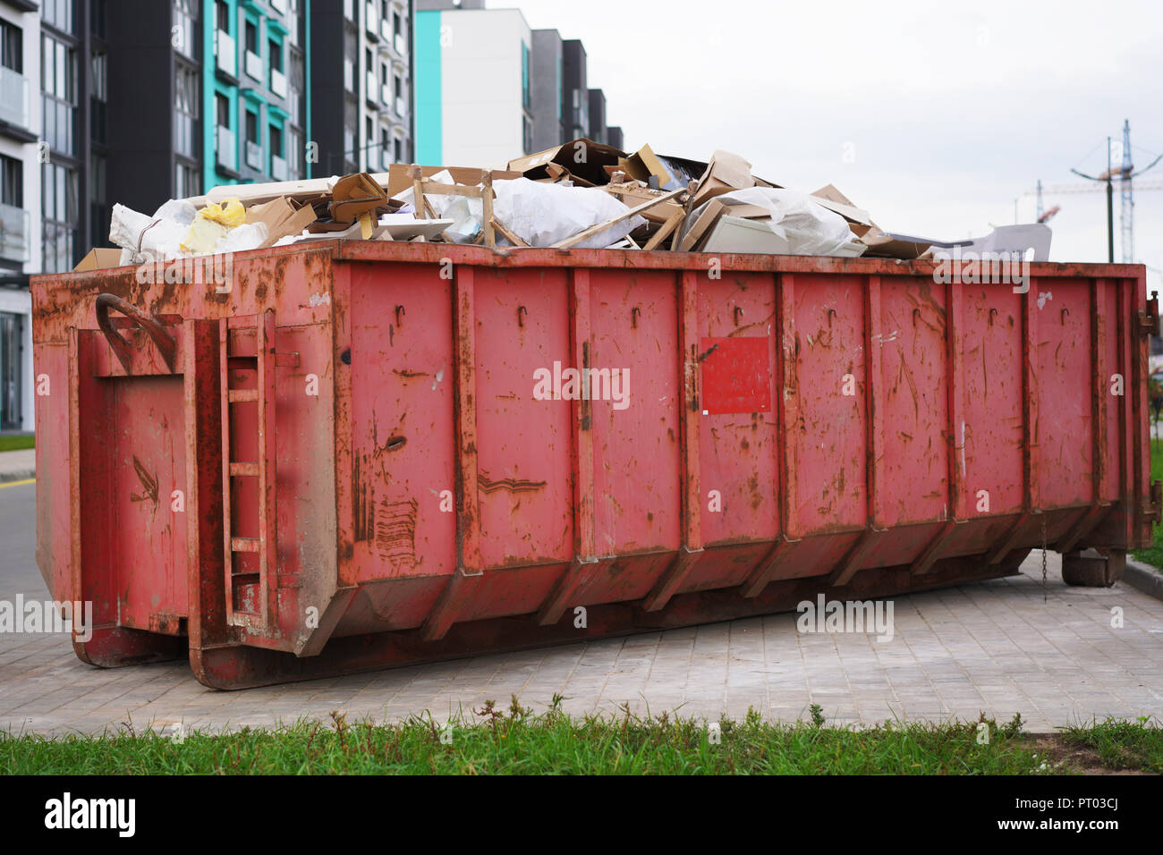 huge garbage can in the street of the city Stock Photo - Alamy