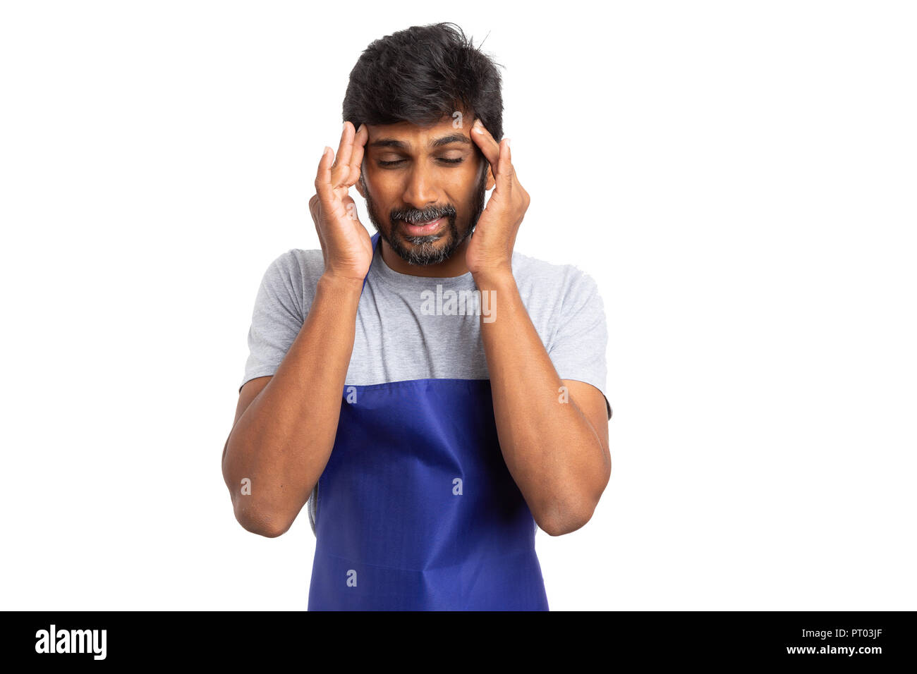 Store manager or supermarket employee with migraine touching temples as ...