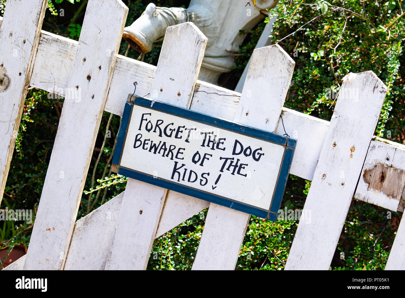 White small five bar entrance gate to a house with a comedy joke ...