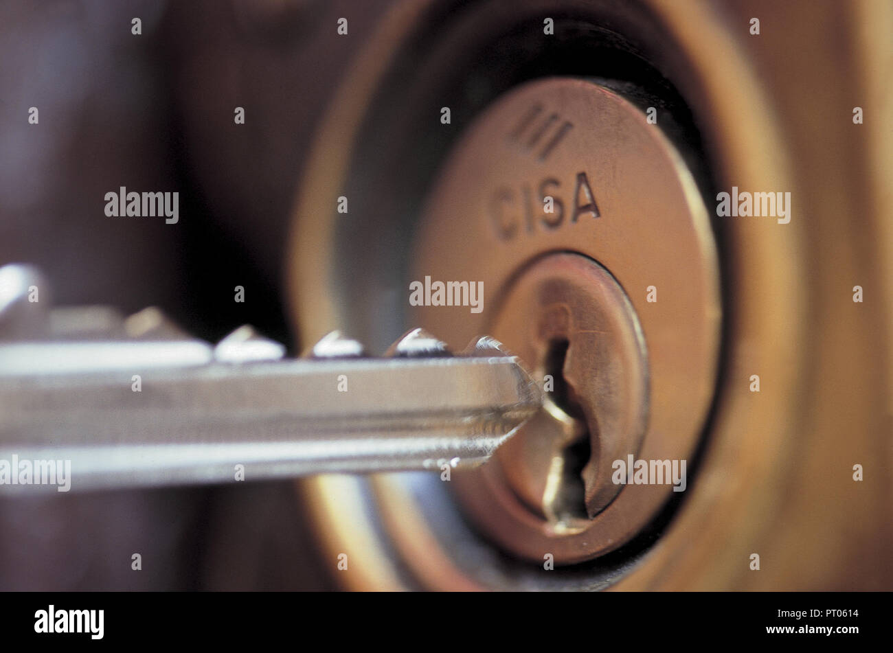 inserting a key in the lock Stock Photo - Alamy