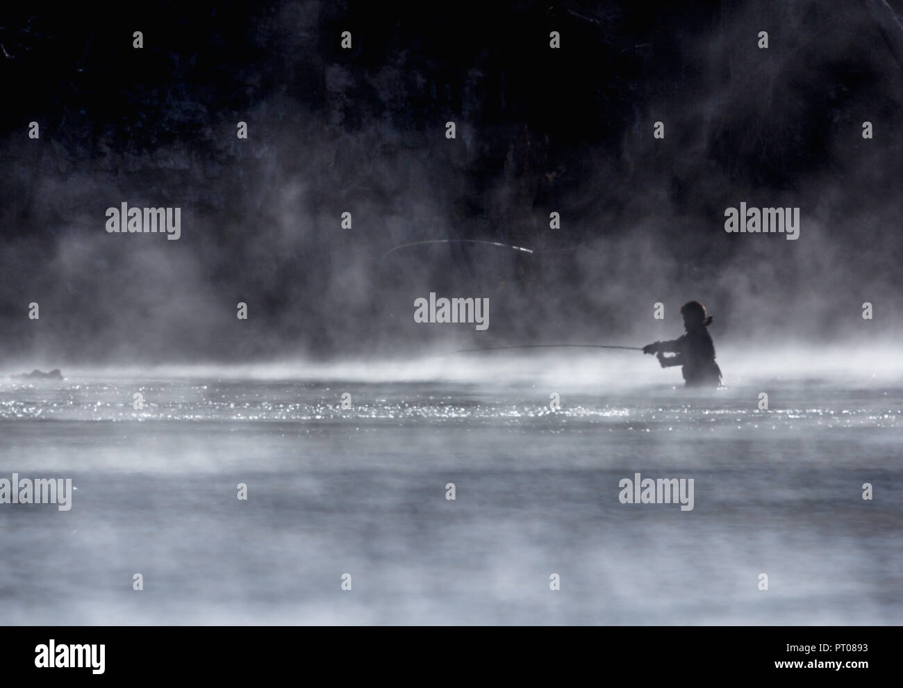 Winter fishing in the fog Stock Photo - Alamy