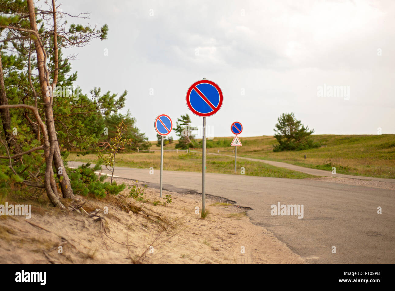 Prohibition signs for cars standing near the seashore Stock Photo - Alamy