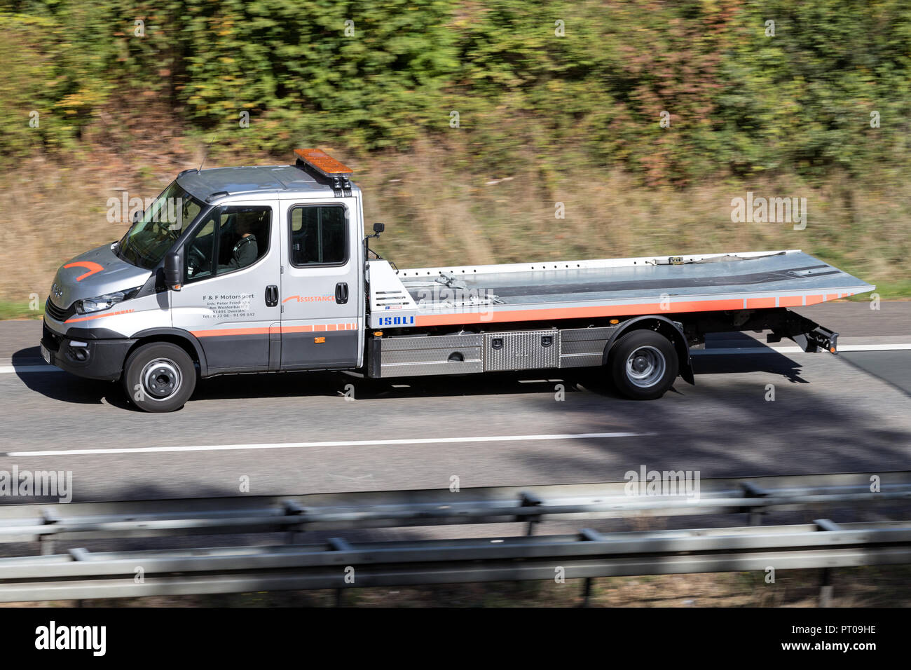 assistance partner recovery vehicle on motorway. assistance partner is ...