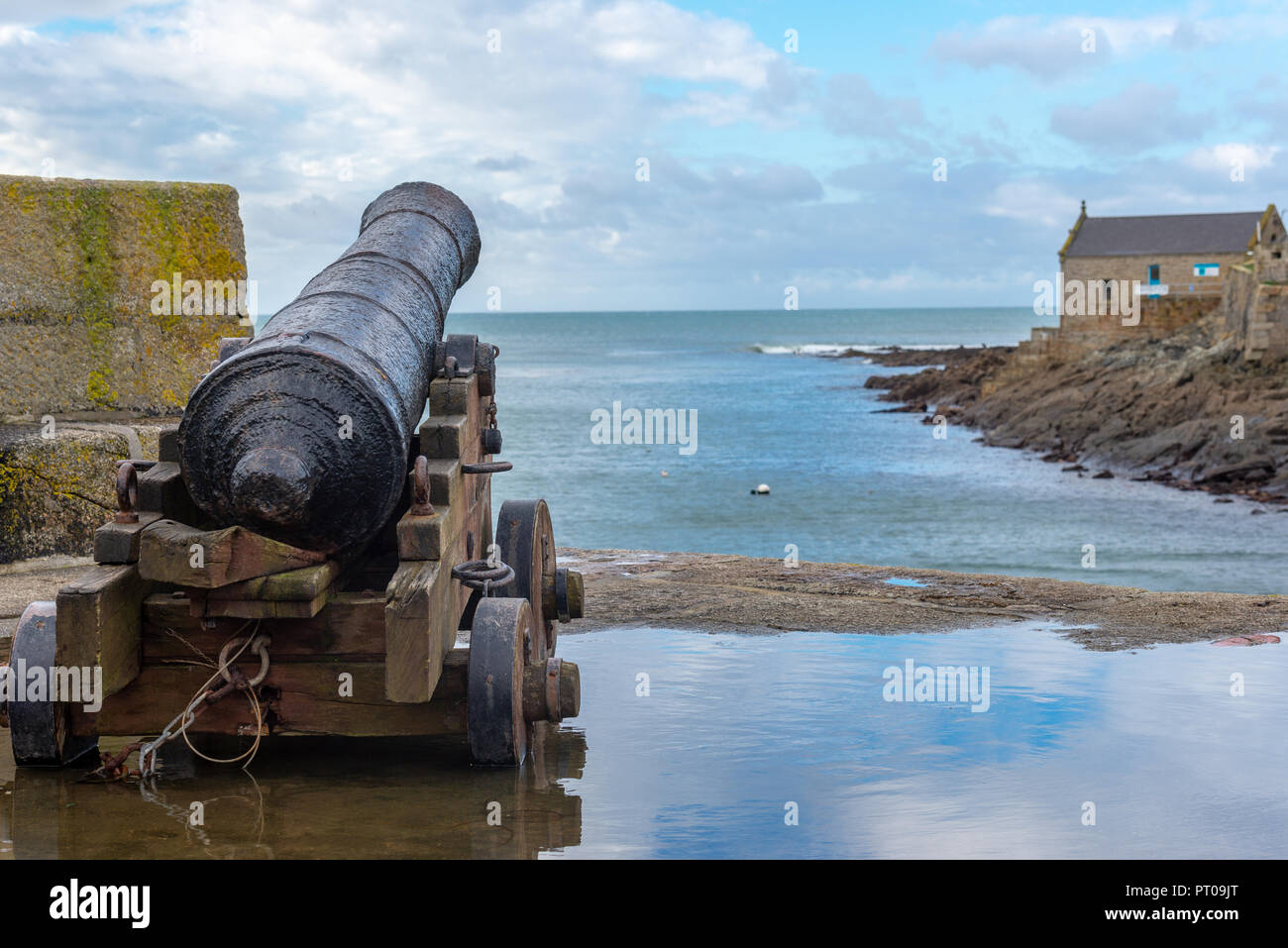 A pair of cannon from HMS Anson stand to protect the fishing harbour of ...