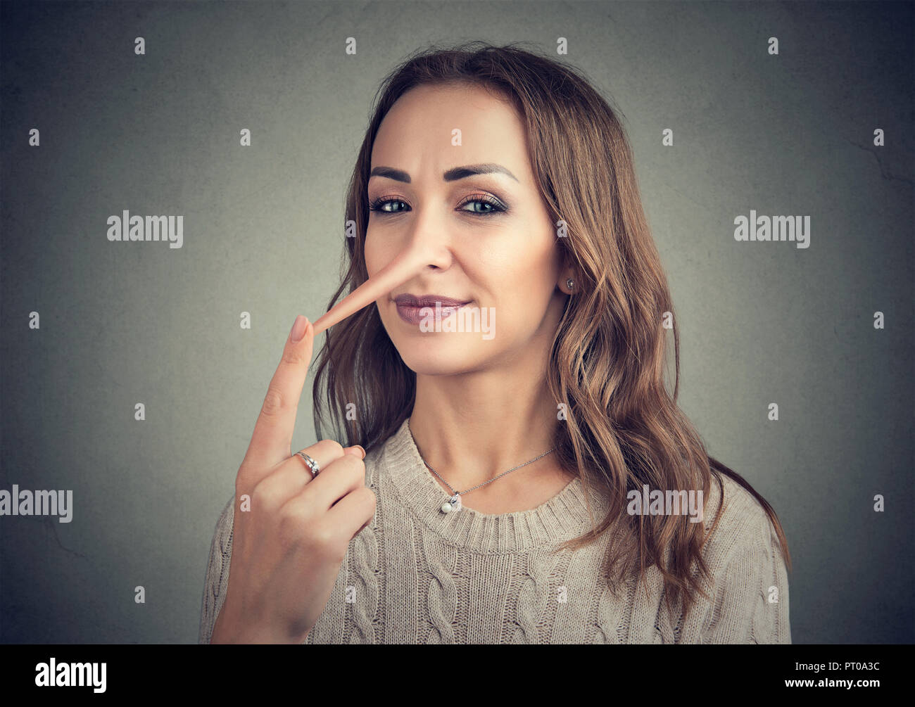 A liar sly woman with long nose Stock Photo - Alamy